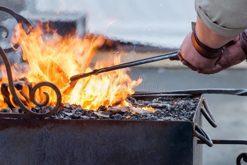 The Work of a Blacksmith with Metal by the Fire Stock Image - Image of ...