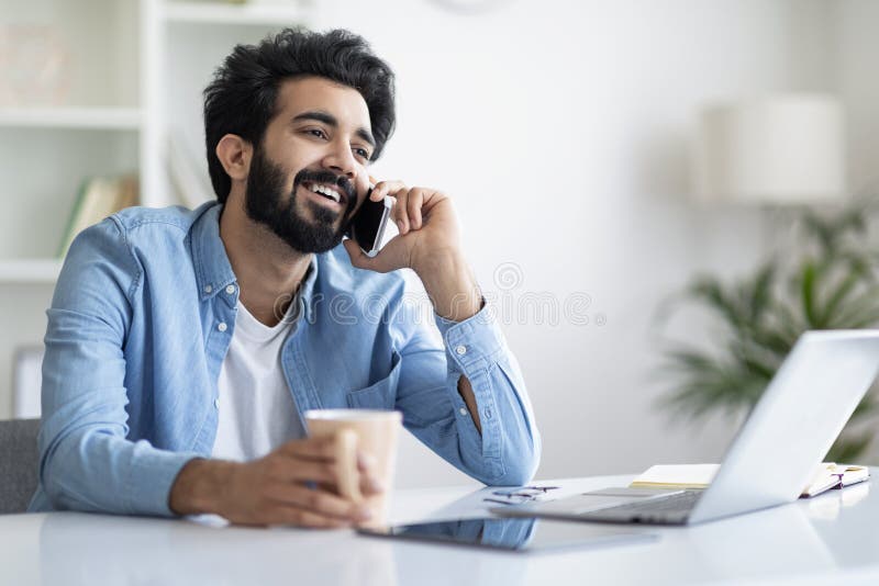 Work Break. Indian Freelancer Guy Relaxing at Desk in Home Office Stock ...