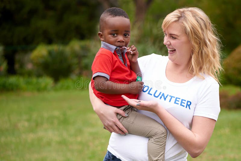 Work for a Cause, Not Applause. Volunteers Working with Little Children ...