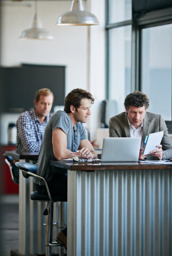 Work always Comes First. Three Businessman Discussing Work in the ...