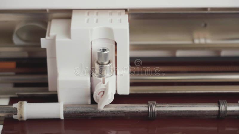 The Work of a Compact Cutting Plotter in Close-up. the Cutting Head of ...