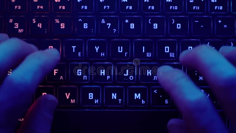Work at the Computer Keyboard. Hand Typing on Neon Laptop Keyboard ... Work at the Computer Keyboard. Hand Typing on Neon Laptop Keyboard ...