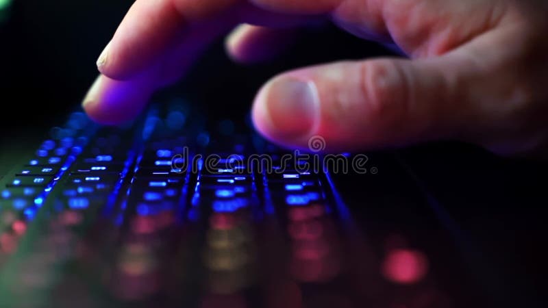 Work at the Computer Keyboard. Hand Typing on Neon Laptop Keyboard ...