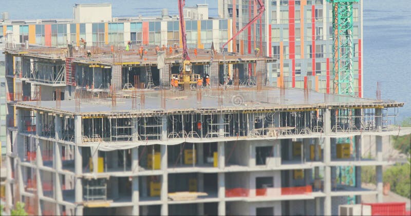 Workers Build House. Construction of a Multi-storey Building. Work at ...