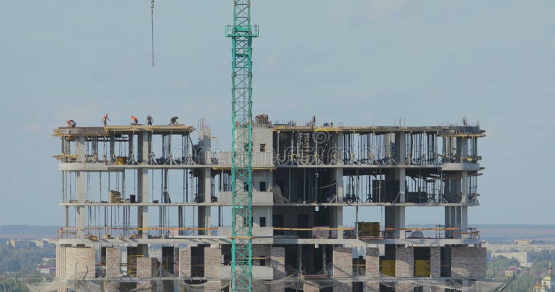 Workers Build House. Construction of a Multi-storey Building. Work at ...