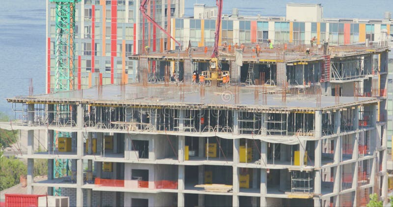 Workers Build House. Construction of a Multi-storey Building. Work at ...