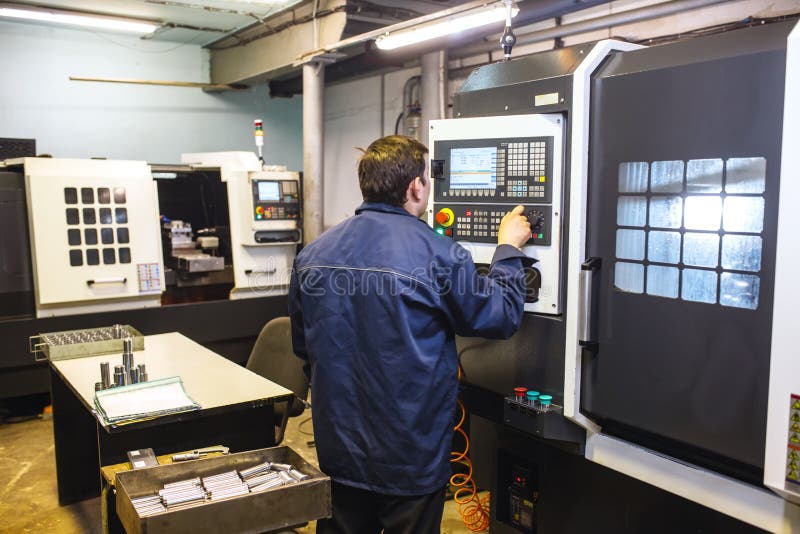 Work on the Control Panel of Machine CNC. Metalworking Milling Machine ...