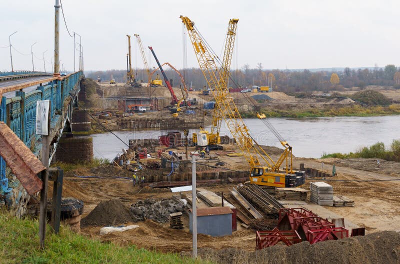 The Work of Cranes and Other Equipment at the Construction Site of the ...