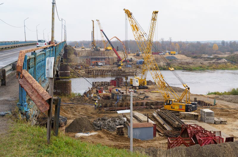 The Work of Cranes and Other Equipment at the Construction Site of the ...