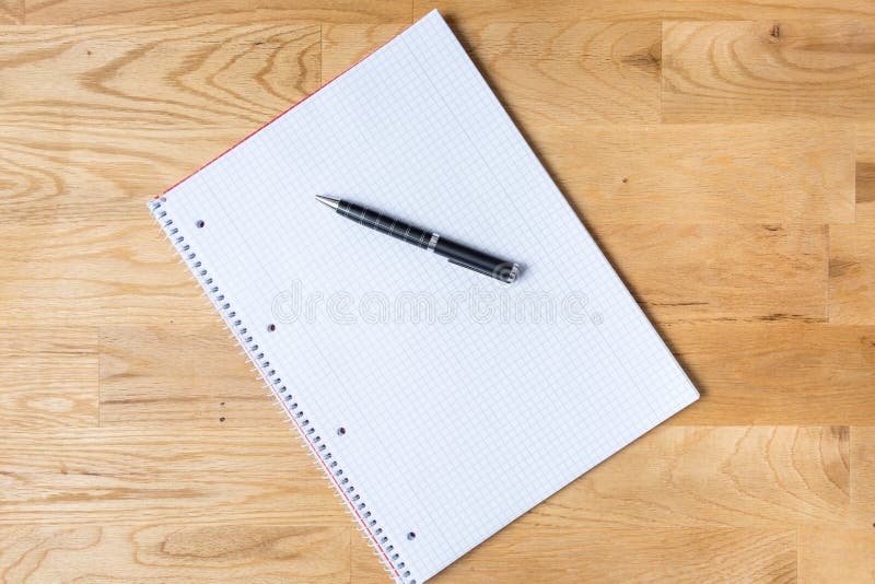 Work Desk with Note Pad and Biro on Wooden Table Stock Photo - Image of ...