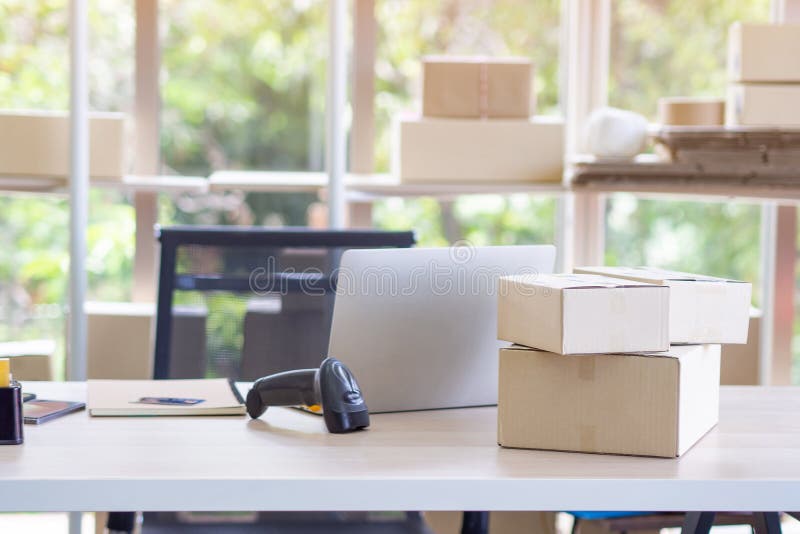Work Desk in the Office Has a Laptop, Packaging Box and Barcode Reader ...
