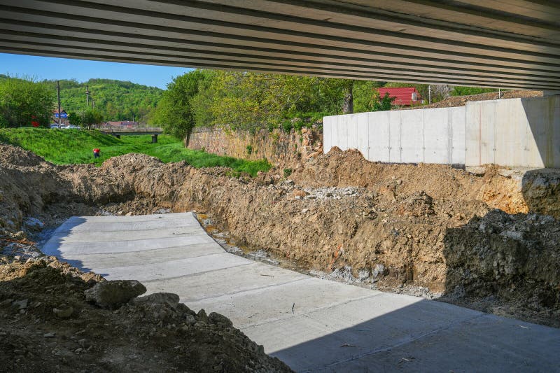 Work on the Development of a Stream Bed Against Erosion and Flooding ...