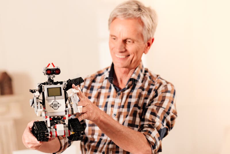 Beaming Senior Engineer Gazing at New Robotic Machine Stock Image ...