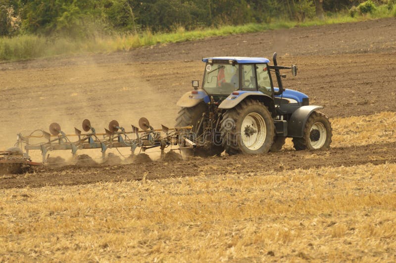 Work in the field plowing stock photo. Image of disc - 64322440