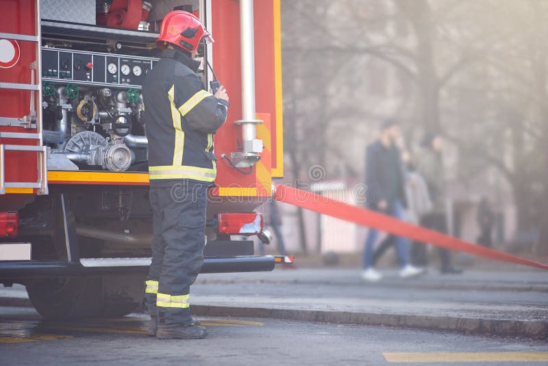 Work of Firefighters. Firefighter with Uniform and Helmet Stock Photo ...