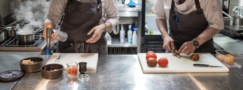 Two Cooks for Cooking. Work with a Flame, Work with a Knife. Stock ...