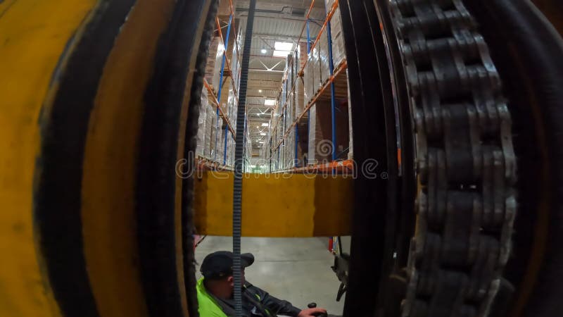 Modern Forklift Works in a Warehouse. the Work of a Forklift in a ...