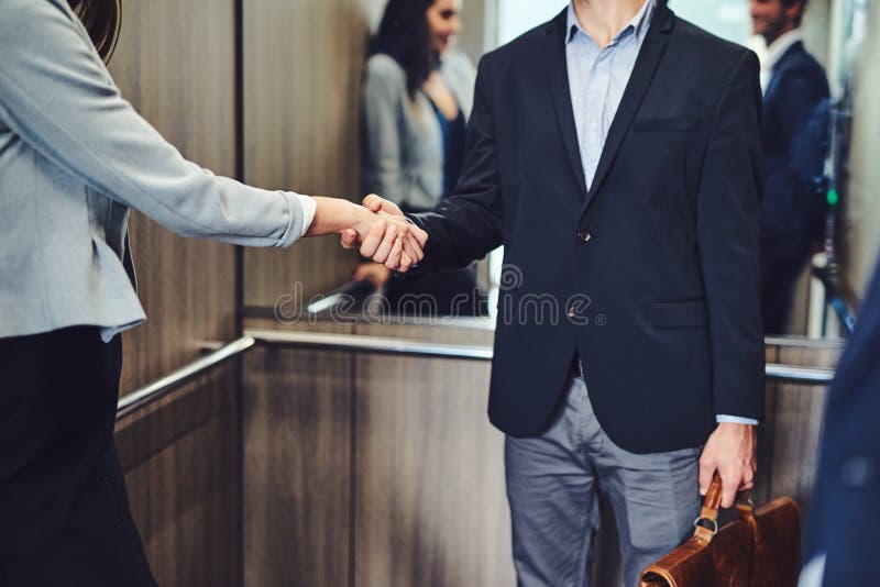 Work, Greeting and Business People with Handshake in Elevator for Job ...