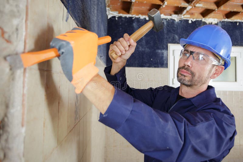 Work with Hammer on Wall Plaster Stock Photo - Image of industrial ...
