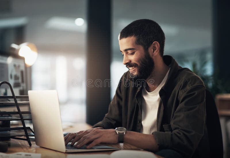 Work Hard and Keep Hitting those Targets. a Young Businessman Using a ...