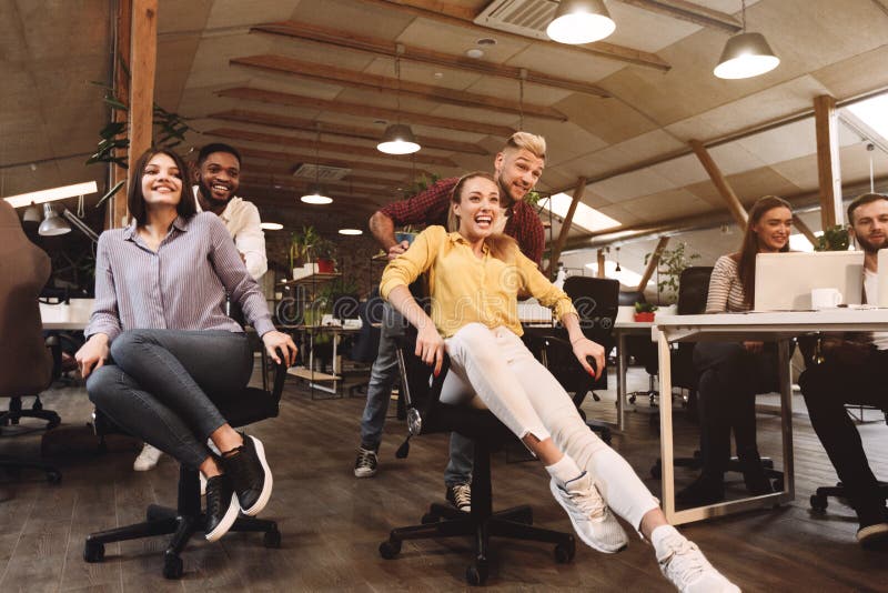 Work Hard Play Hard. Business People Having Fun in Office Stock Photo ...