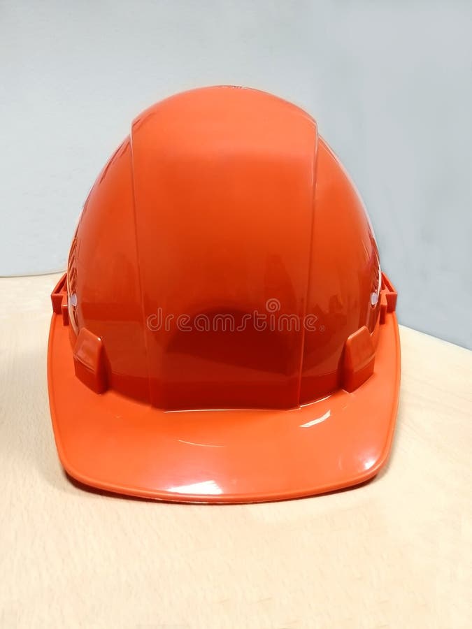 Work Helmet Orange on the Table, Safety Helmet. Editorial Photography ...