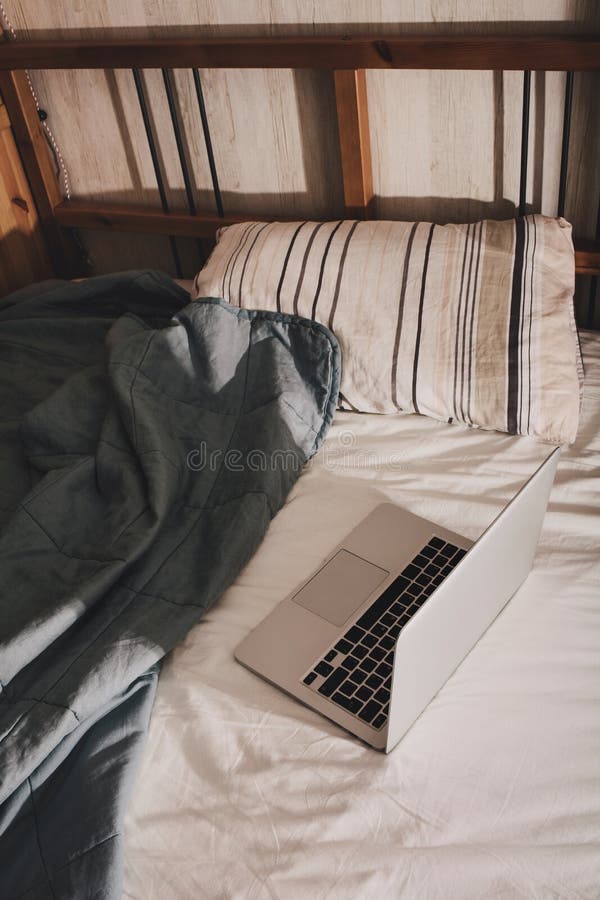 Work from Home. the Laptop Lies on the Bed Stock Image - Image of ...