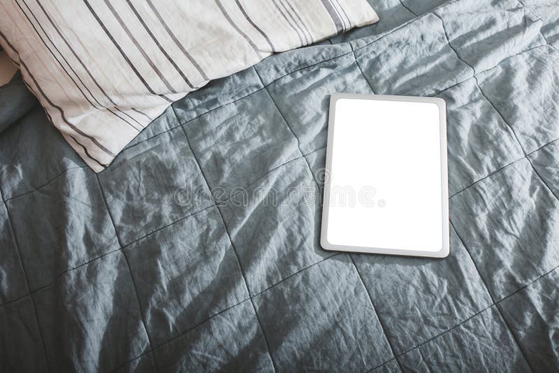 Work from Home. a Tablet with a White Screen Lies on a Disassembled Bed ...