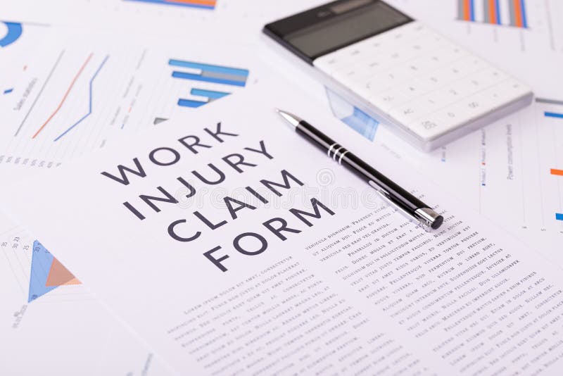 Work Injury Claim Form Concept, Documents on the Desktop Stock Photo ...