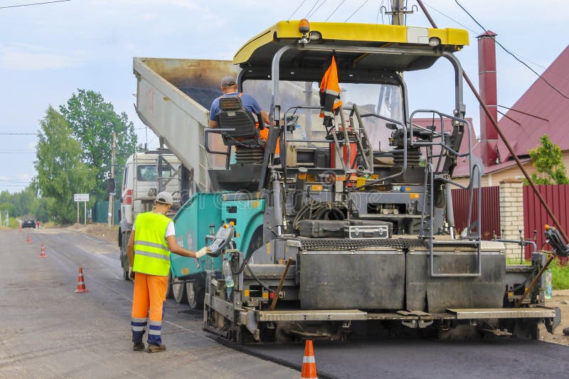 Work On Laying The New Tile On A City Street. Lays The New Tile On The ...