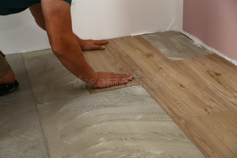 Work on laying flooring stock image. Image of construction - 124073093