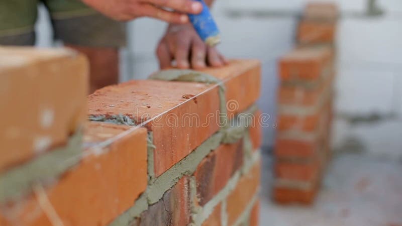 Work Lays Bricks on a Construction Site Stock Footage - Video of ...