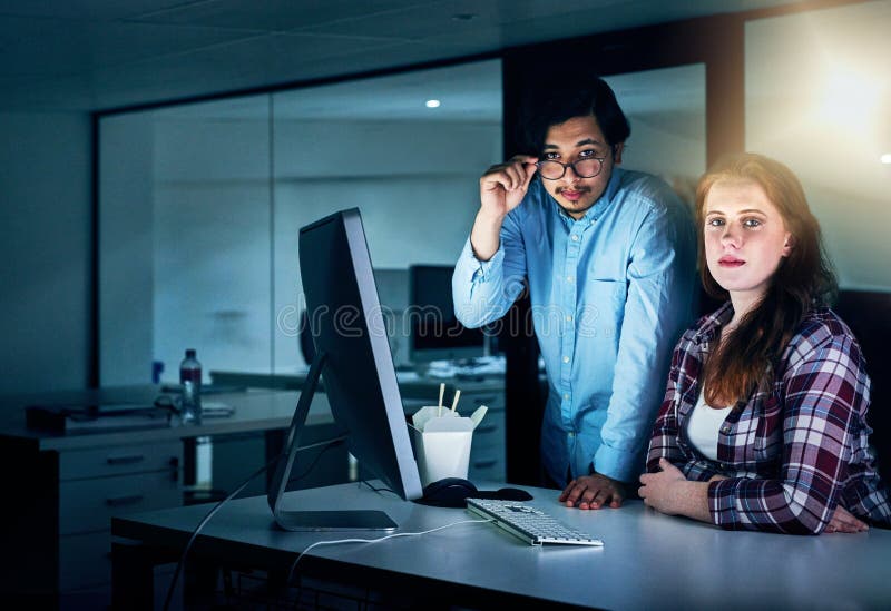 We Work Long Hours To Get the Work Done. Portrait of Two Focussed Young ...