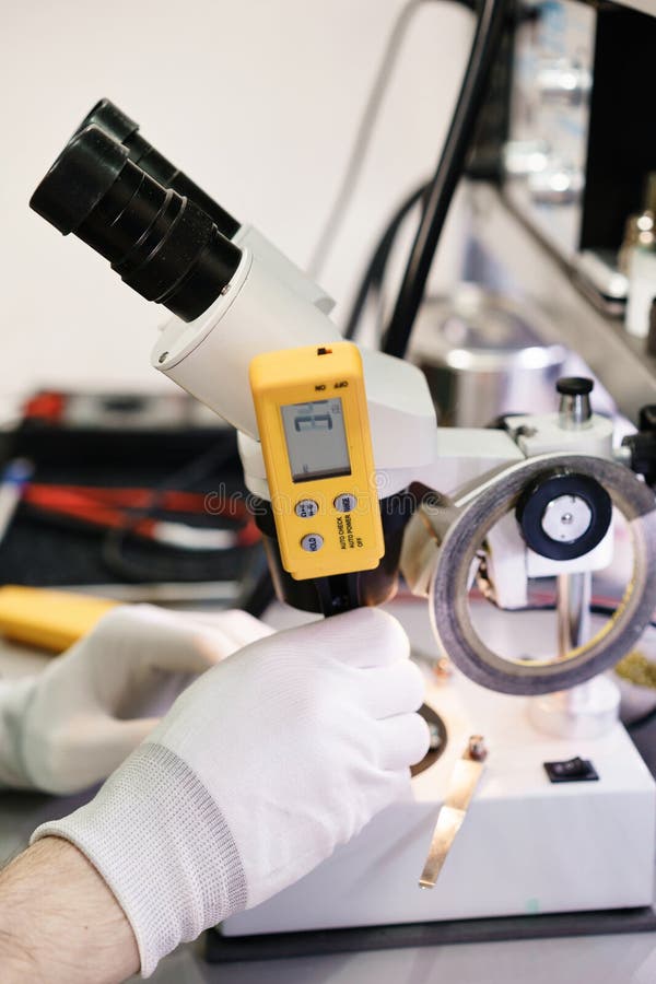 Work with a Microscope. Microelectronics Device. Close-up Hands of a ...