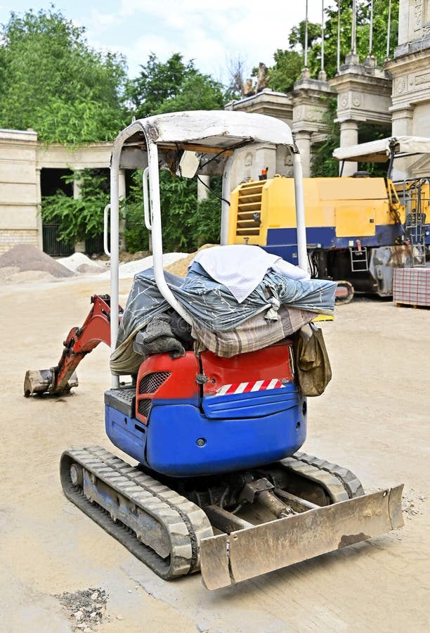 Mini excavating machine stock image. Image of digger - 318771385
