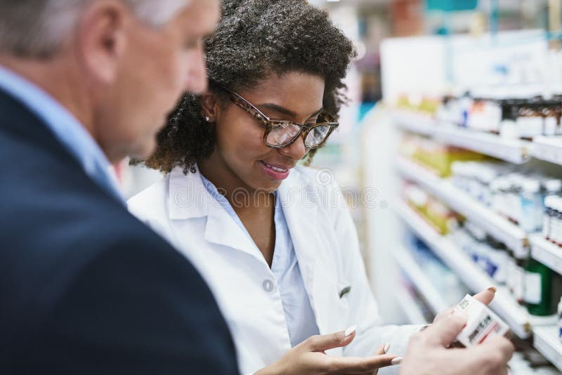 These Work Miracles. a Helpful Young Female Pharmacist Helping a ...