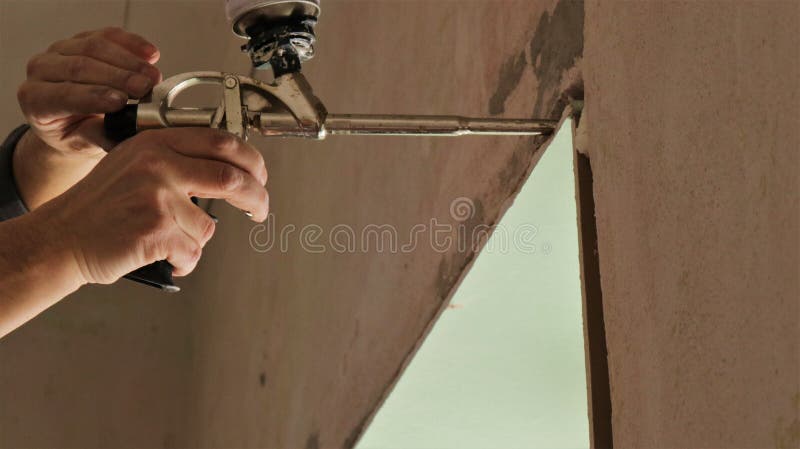 Work with a Mounting Gun when Installing Slopes Stock Photo - Image of ...