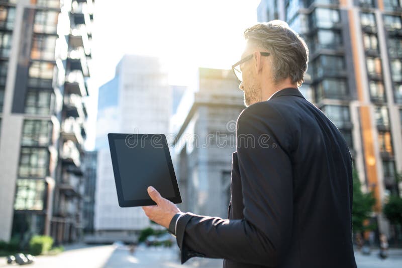 A Businessman with a Tablet in Hands Looking Busy Stock Photo - Image ...