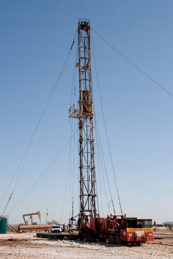 Work Over Rig, Pumpjack, and a Drilling Rig Stock Image - Image of ...