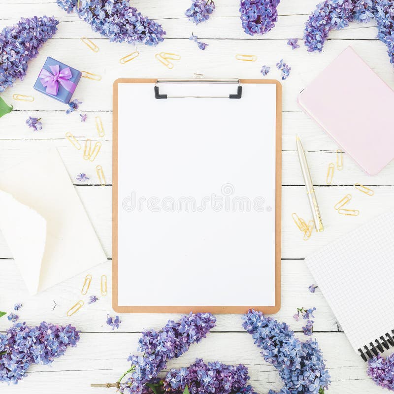 Work Place Composition with Clipboard, Diary, Lilac Flowers and ...