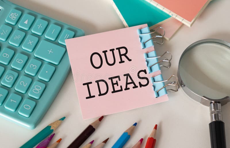 Work Place. Pen and Paper with OUR IDEAS Text Stock Image - Image of ...