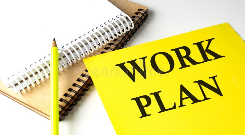 WORK PLAN Text Written on a Yellow Paper with Notebook Stock Image ...