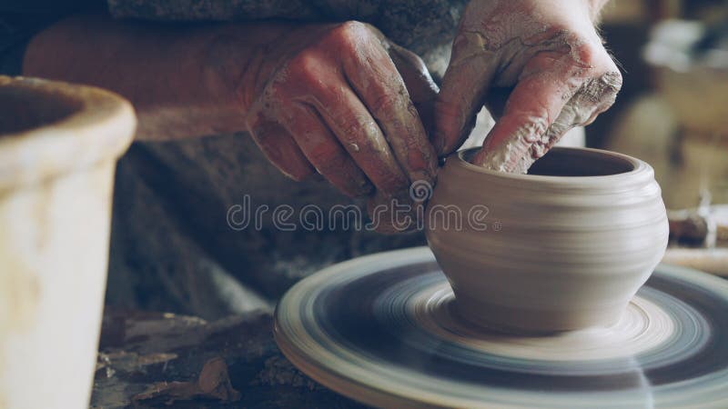 Work in Pottery Workshop: Clay Ware on Throwing Wheel, Master Ceramist ...