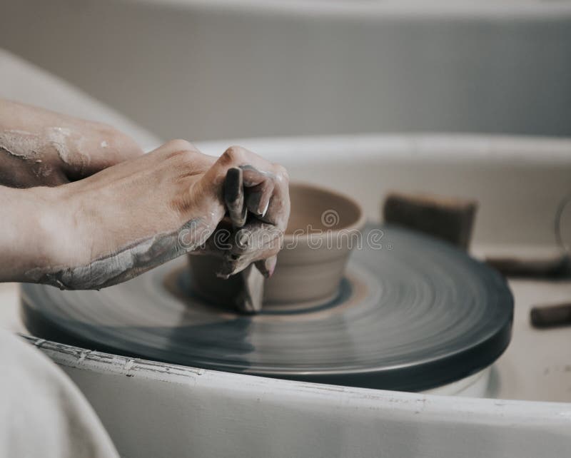 Work in a Pottery Workshop. Close-up of Hands and Potter`s Wheel Stock ...