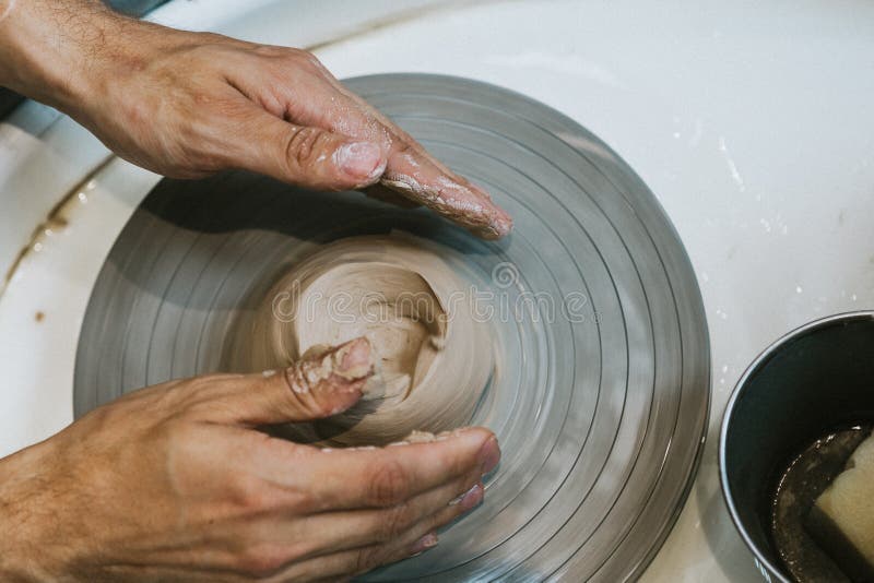 Work in a Pottery Workshop. Close-up of Hands and Potter`s Wheel Stock ...