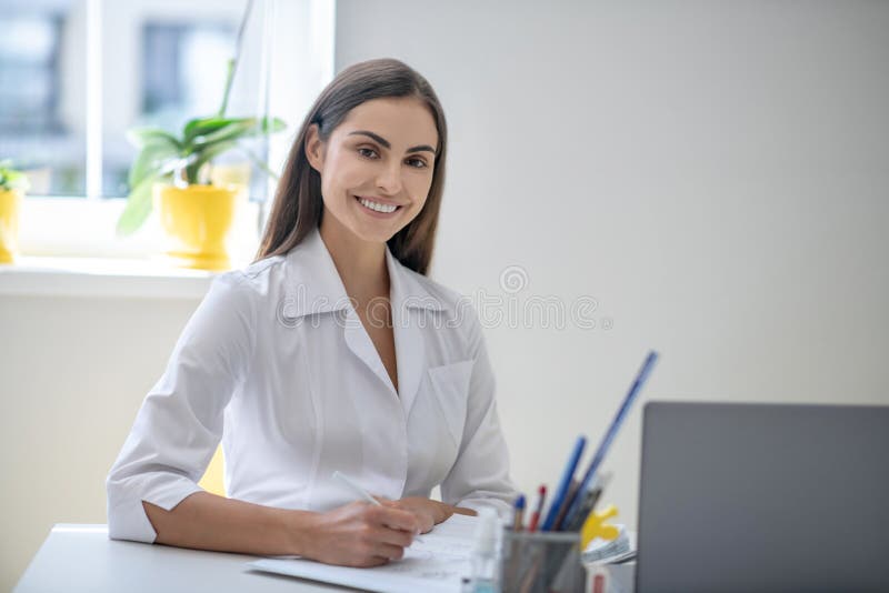 Pretty Doctor in a Lab Coat Smiling Stock Photo - Image of experienced ...