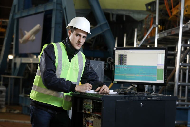 Portrait of a Man , Factory Engineer in Work Clothes Controlling the ...