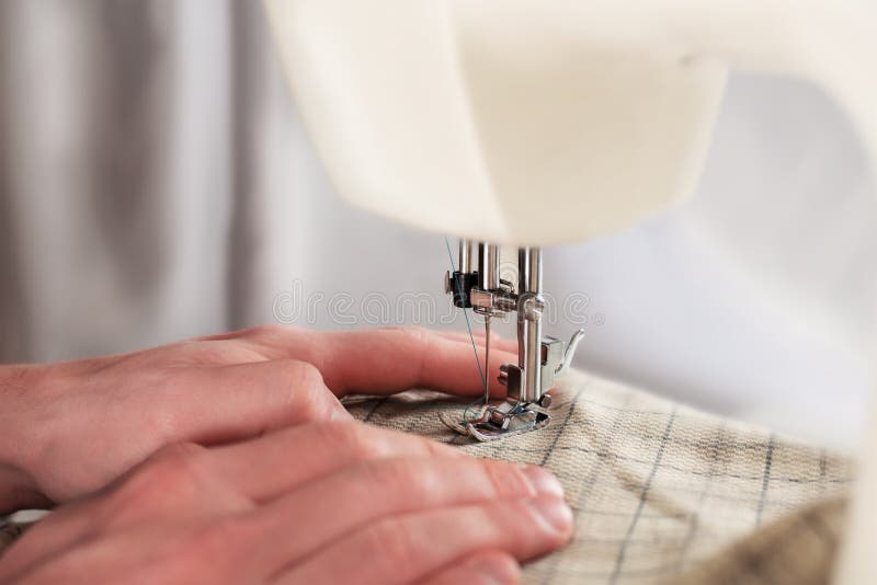 Work in Process - Sewing Machine and Hand of Tailor with Needle, Thread ...