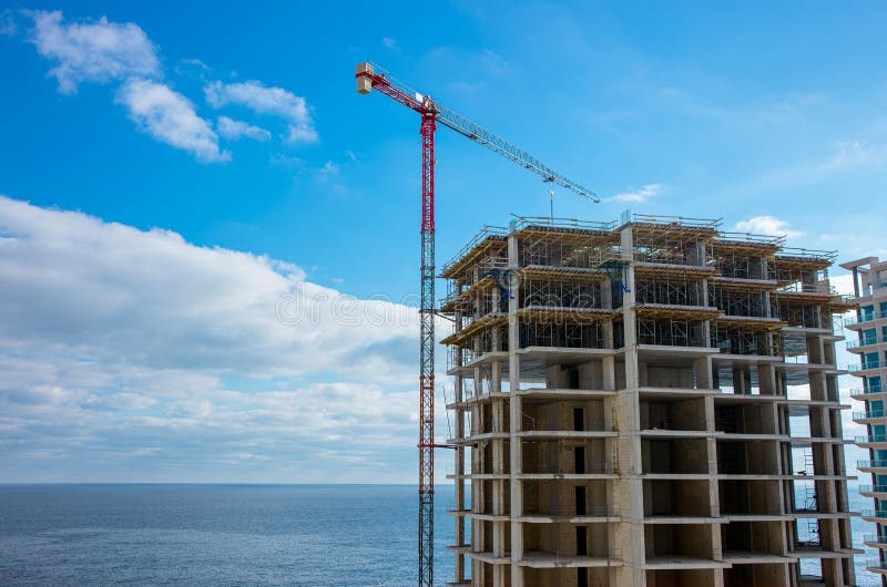 Work in Progress, Building Tall Luxury Tower Building by the Sea. Stock ...