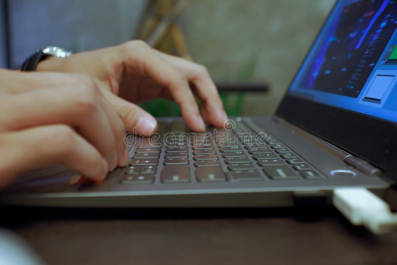 Productive Digital Workspace: Close-Up View of Hands Typing on a Laptop ...